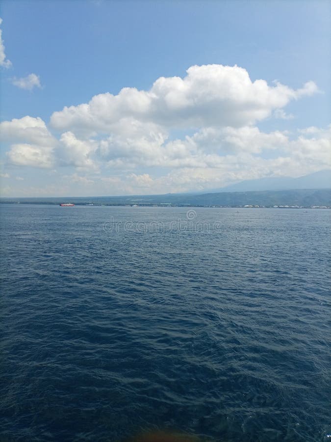 Bali strait sea stock photo. Image of strait, blue, cloudy - 262452212