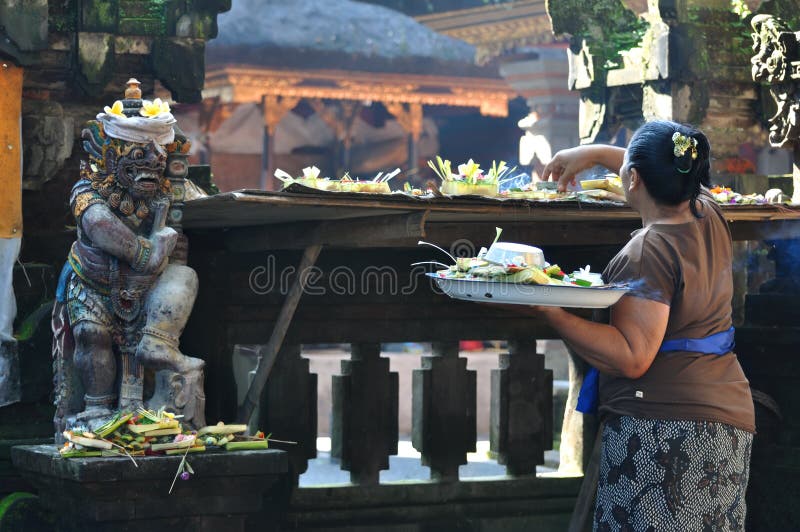 Balinese woman praying editorial stock photo. Image of holy - 17122493