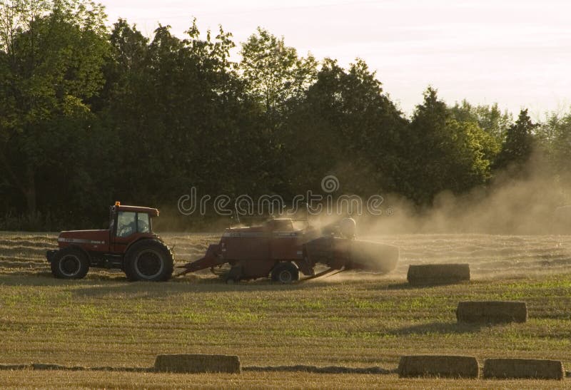 Baling hay stock photo. Image of farmland, farm, hayfield - 1085118