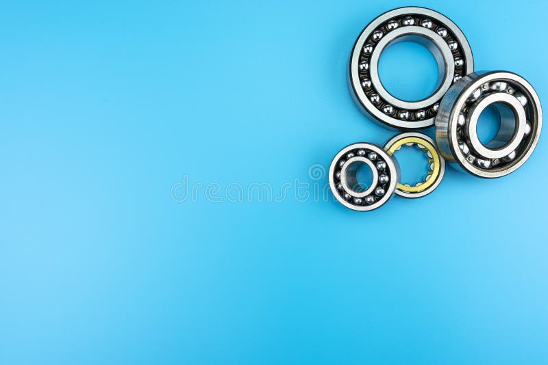 Ball Bearing Lying on a Blue Background with Copy Space on the Left ...
