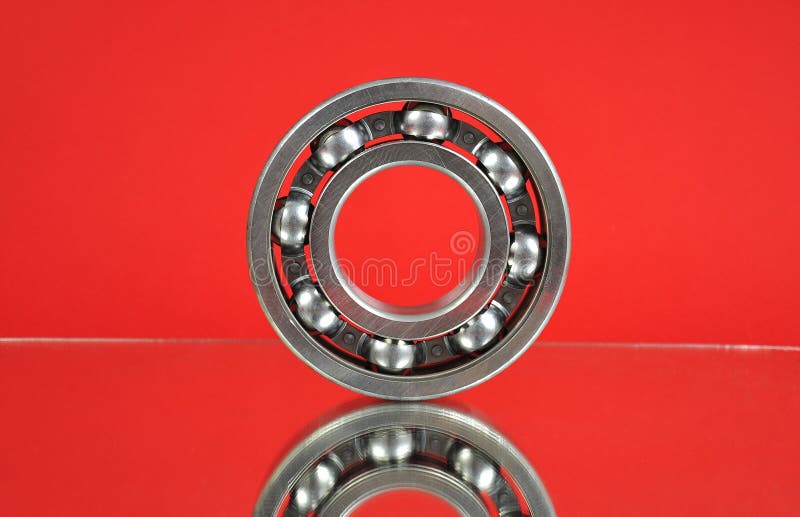 Ball Bearing on a Mirror Surface. Stock Photo - Image of engineering ...