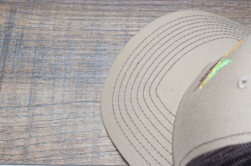 Ball Cap Bill on a Wood Floor Stock Image - Image of stitched, wood ...
