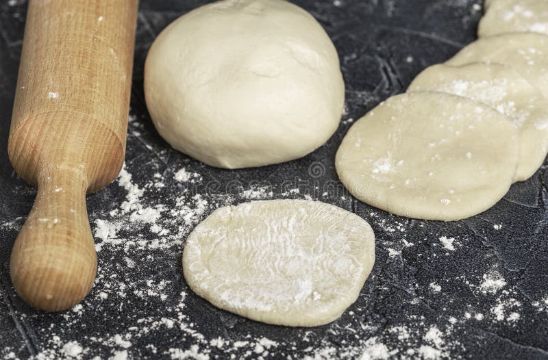 Ball of Fresh Raw Dough, Flour and Rolling Pin Top View Stock Photo ...