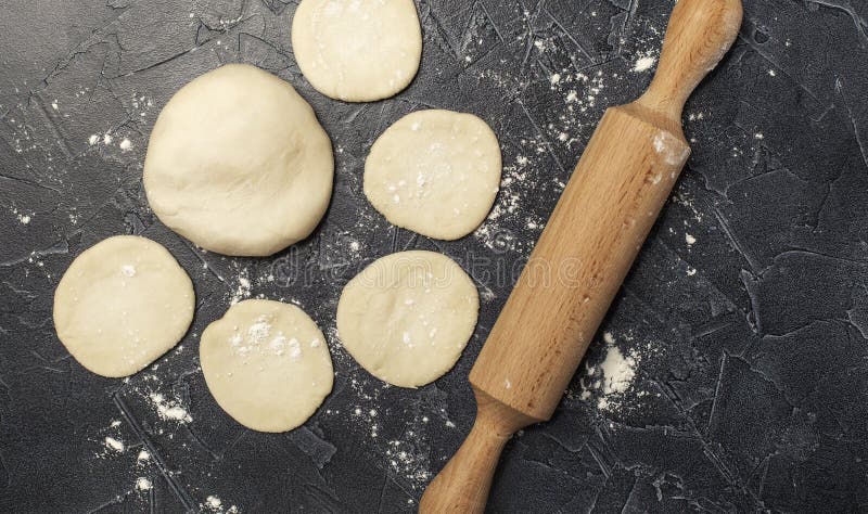 Ball of Fresh Raw Dough, Flour and Rolling Pin Top View Stock Photo ...