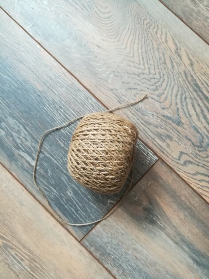 A Ball of Jute Thread on a Laminate Floor Stock Photo - Image of thread ...