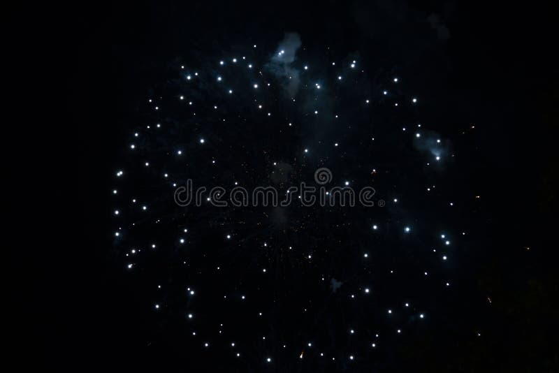 Illuminated Round Firework at Night. Stock Photo - Image of haze ...