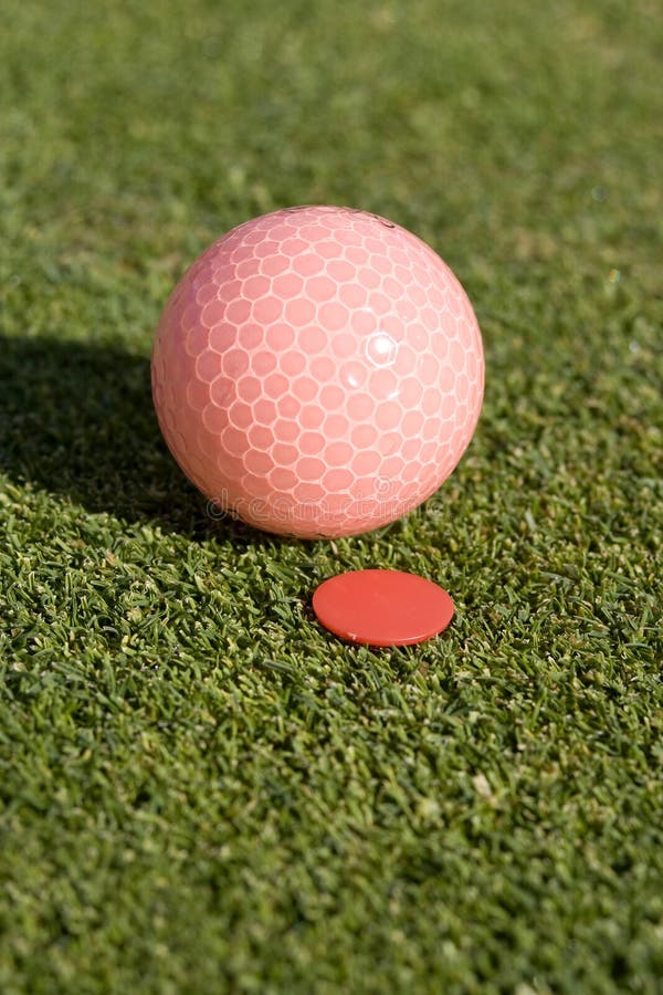 Ball Next To Marker on Green - Vertical Stock Image - Image of park ...