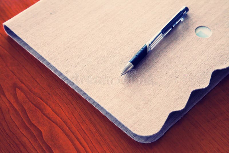 Ball Pen and Notebook on the Wooden Desk Stock Photo - Image of list ...