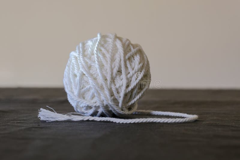Ball of White Cotton Thread on Black Cloth Stock Photo - Image of ball ...