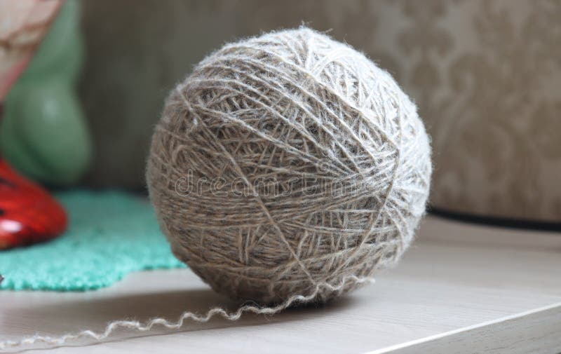 A Ball of Woolen Threads on the Table Stock Photo - Image of photograph ...