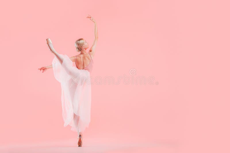 Ballerina in Pink Leotard Dancing on Pink Background Stock Image ...