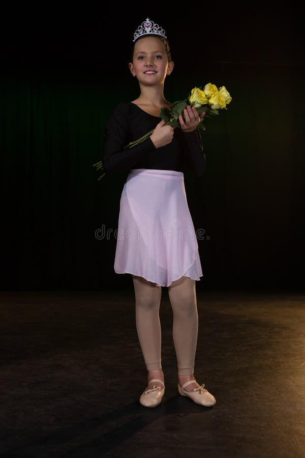 Ballerina Posing With Flower Bouquet On Stage Stock Image Image Of