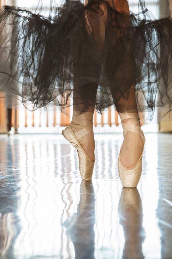 Female Ballet Dancer Posing on a Toptoe in a Dance Class. Stock Image ...