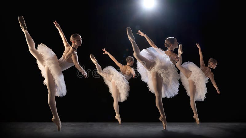 Ballerinas Performing Under Dramatic Spotlight, Creating Striking ...