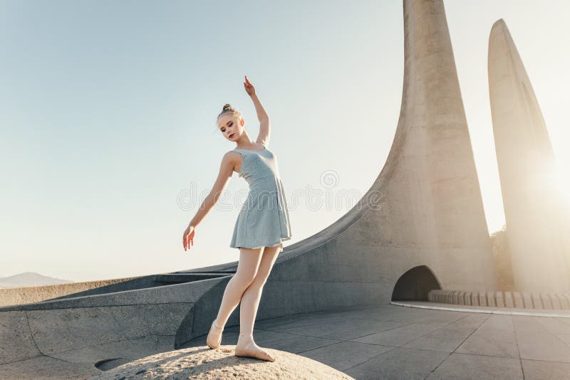 Female Ballet Dancer Practicing Dance Moves on a Rock Stock Photo ...
