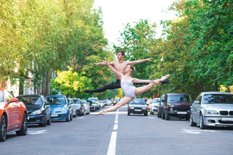 Ballet Couple Dancing on the Road among Cars. Stock Image - Image of ...