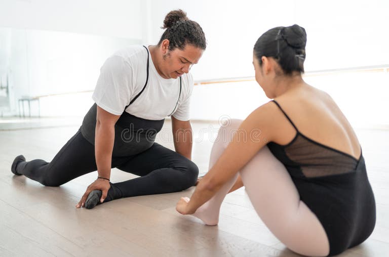 Ballet Dancer Couple Stretching and Warming Up before Exercise a ...