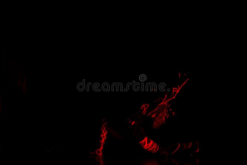 Ballet Dancer Dancing in Front of and Red Light while Expressing the ...