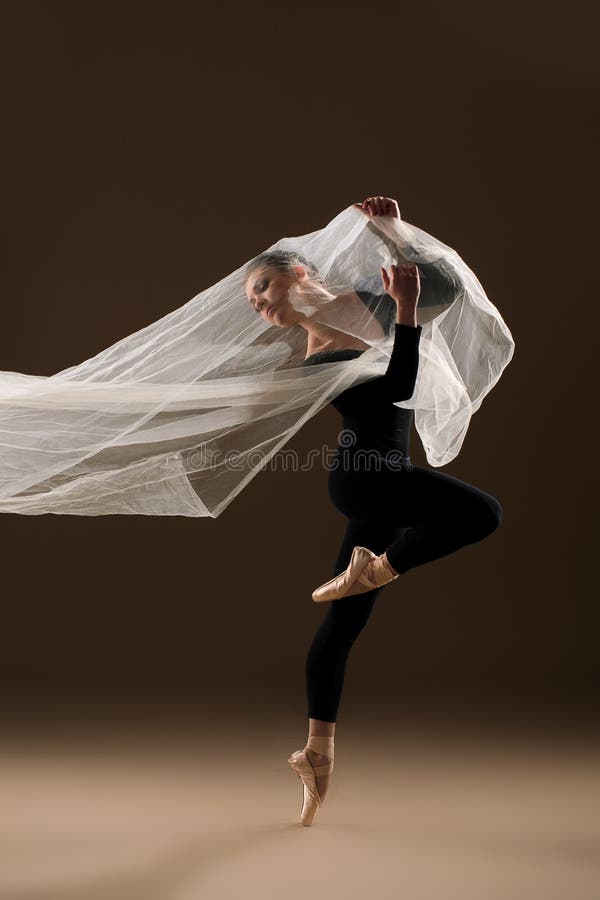 Ballerina Jumping in White Silk Dress, Modern Ballet Dancer in Pointe ...