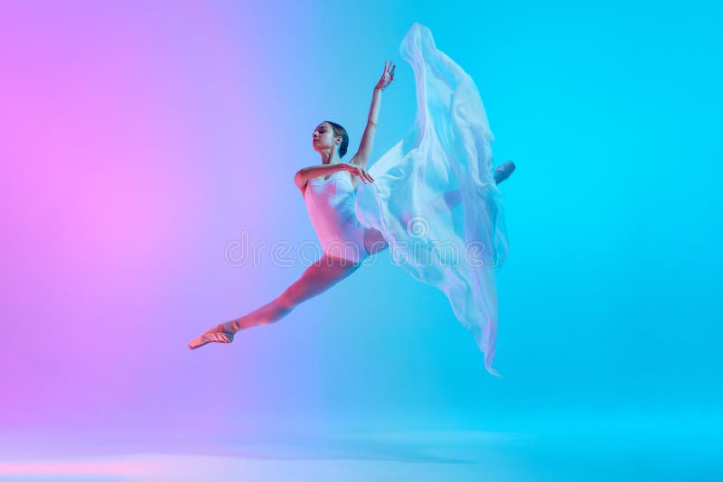 Ballet Dancer Performs Jumping Split in Motion with Flowing White Cloth ...