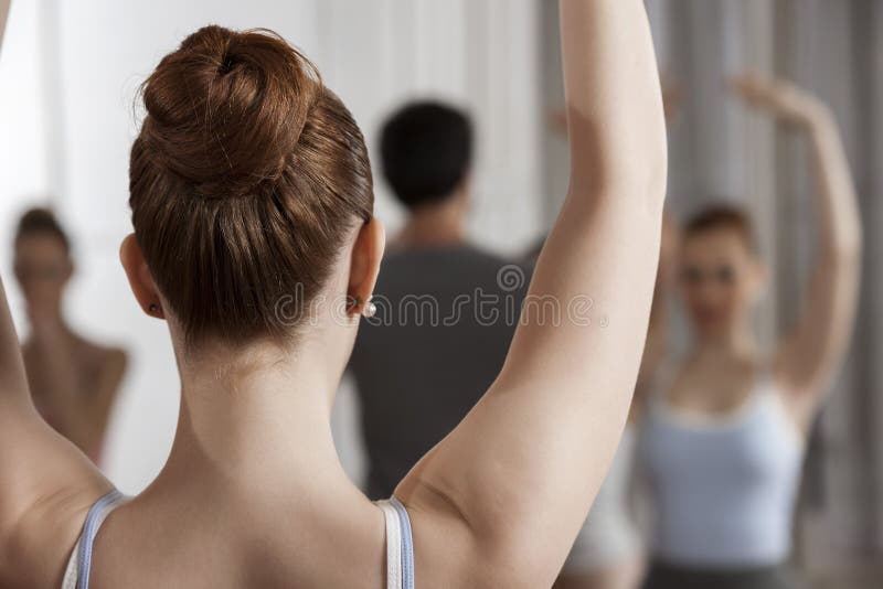 Ballet Dancer Raising Arms in Dance Studio Stock Photo - Image of ...
