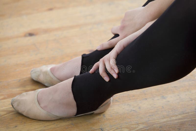 Ballet Dancer Relaxing on Wooden Floor Stock Image - Image of black ...