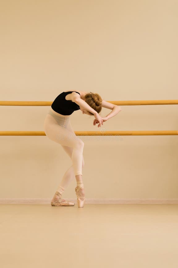 Ballet Dancer Stretching, Leaning Forward with Curved Posture Stock ...