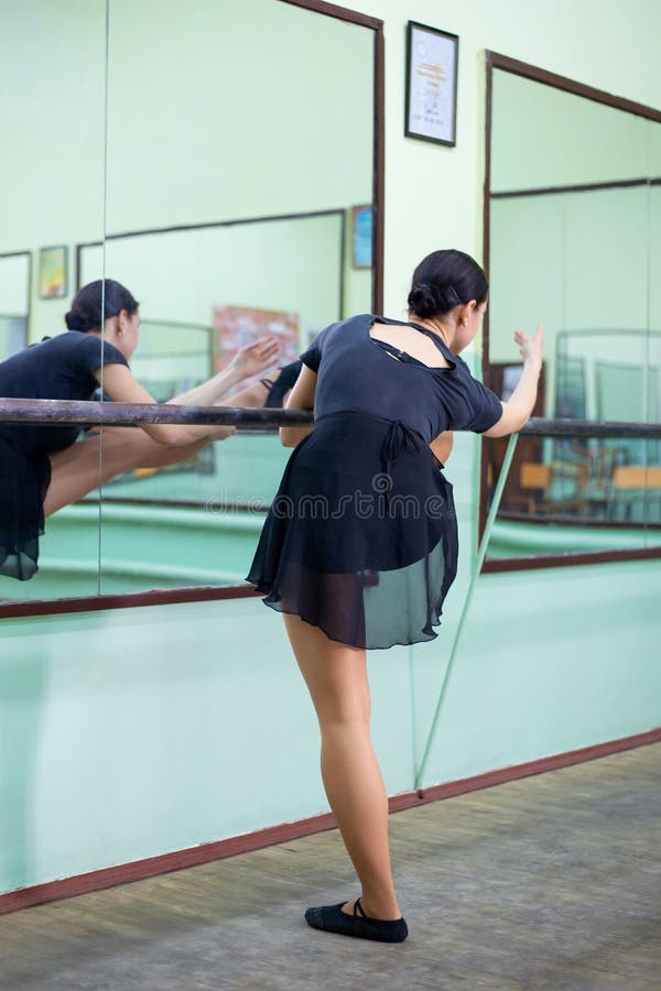 Ballet Dancer Stretching in Dancing Studio Stock Photo - Image of ...