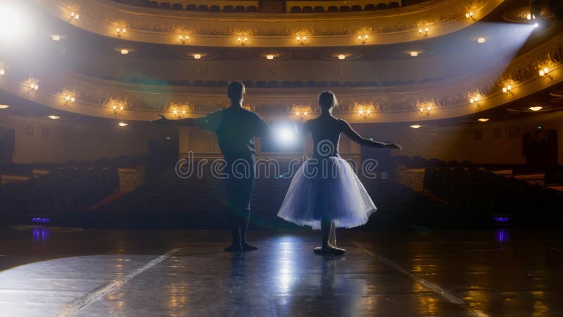 Ballet Dancers Bow Down in Front of Rows of Seats Stock Image - Image ...