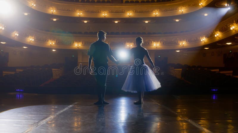 Ballet Dancers Bow Down in Front of Rows of Seats Stock Image - Image ...