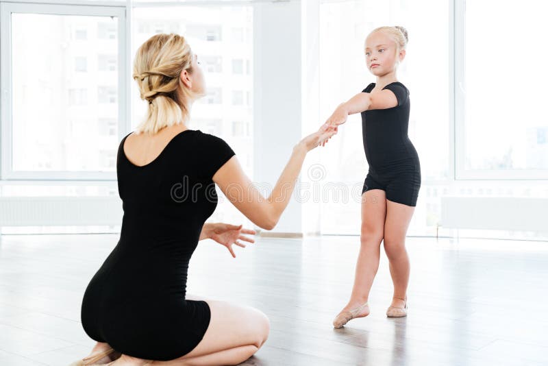 Ballet Instructor Directing Little Cute Ballerina during Dance Practice ...
