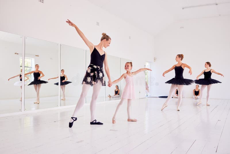 Ballet Instructor or Teacher Teaching a Young Dancer in a Class or ...