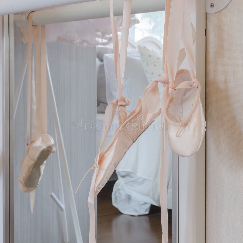 Pointe Shoes Hang on Ballet Barre. Ballerina Has Dance Workout. Girl is ...
