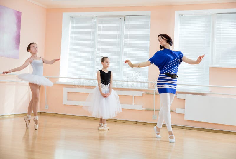 Ballet Teacher and Young Students Stock Image - Image of practicing ...