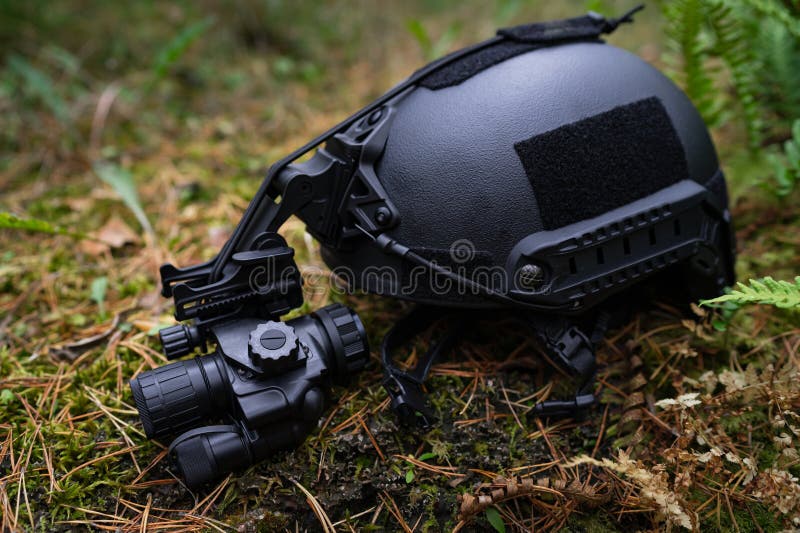 Ballistic Helmet with Night Vision Monocular Lies on the Ground Stock ...