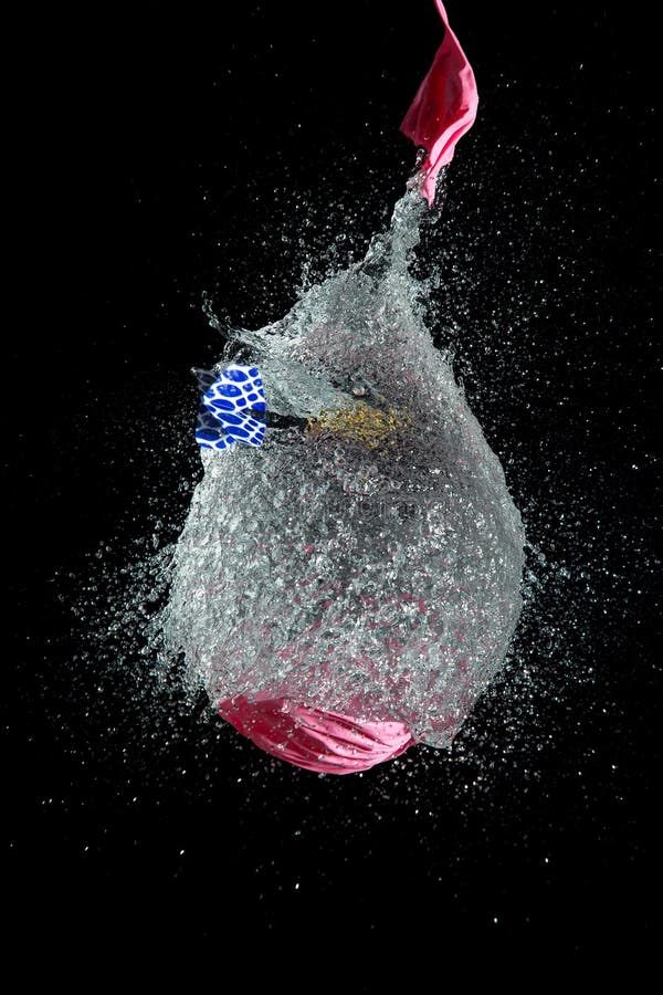 Balloon Filled with Water is Popped with Dart To Make a Mess Stock ...