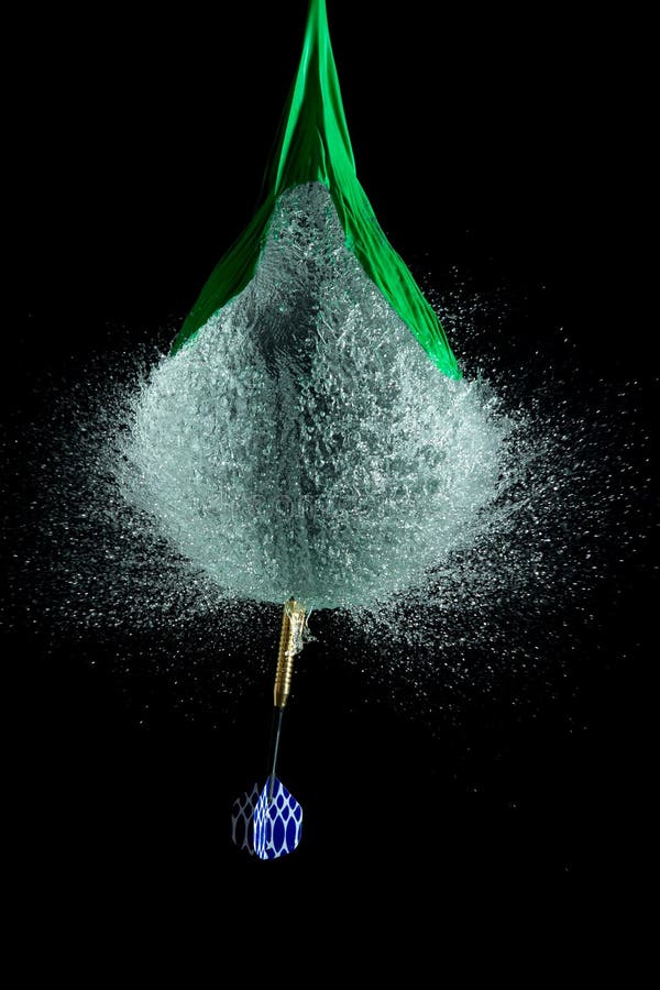 Balloon Filled with Water is Popped with Dart To Make a Mess Stock ...