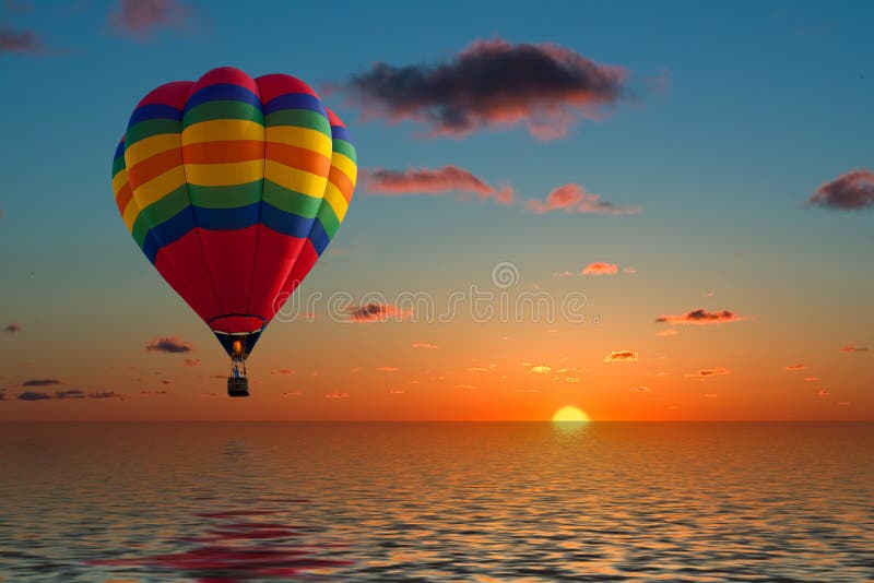 Balloon flying into sunset stock photo. Image of ballon - 12045270