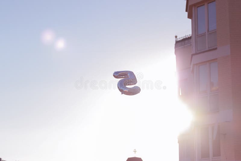 A Balloon in the Form of the Number 5 Flies into the Sky Stock Photo ...