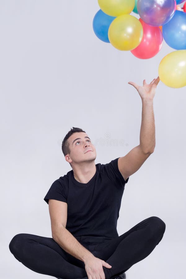Boy catching balloons stock image. Image of cheerful - 27719375