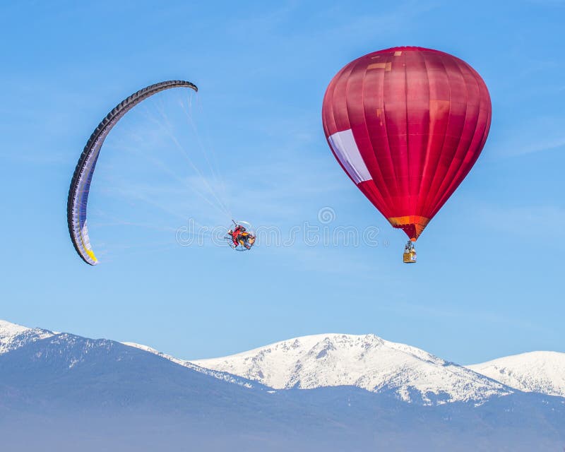 Balloon with Moto Glider in Winter Mountain Stock Image - Image of ...