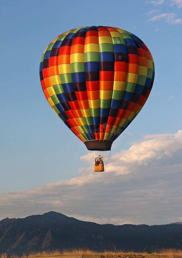 Balloon Rising in the Rockies Stock Photo - Image of portrait, pattern ...