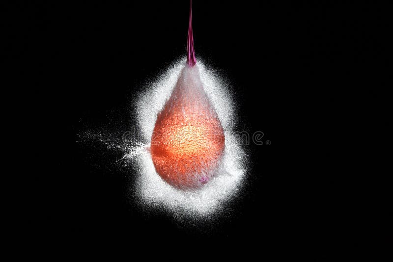 Bursting a water balloon stock image. Image of splash - 4852369