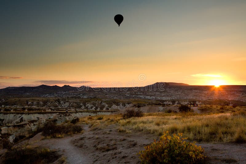 Balloon at Sunset Flying Above Cappadocia Stock Photo - Image of ...