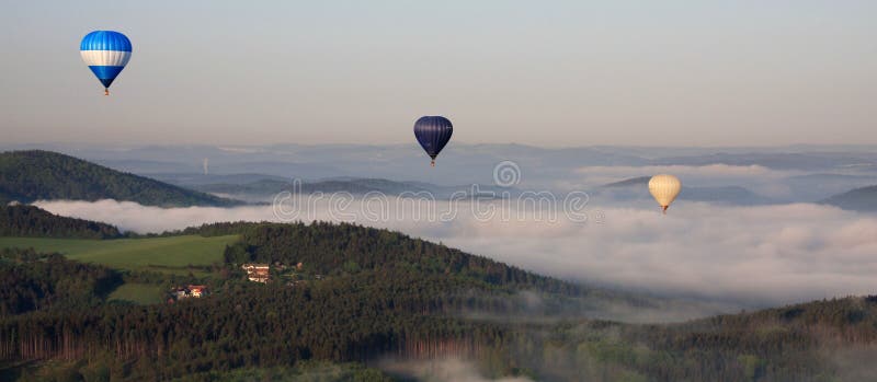 Hot Air Balloon Flying at Dawn Stock Photo - Image of dawn, moody ...