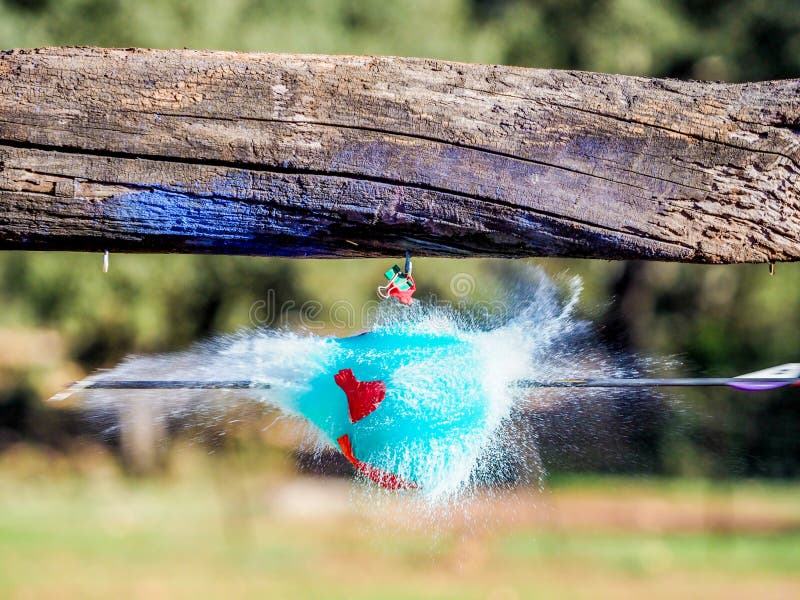 Balloons Exploding when Hit by an Arrow. Closeup Hi-speed Shot Stock ...