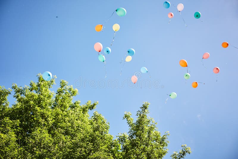 Balloons Fly Away on a Background of Blue Sky. Stock Image - Image of ...