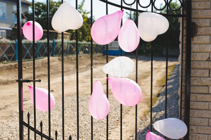 Balloons on Metal Fence stock photo. Image of decoration - 68421484
