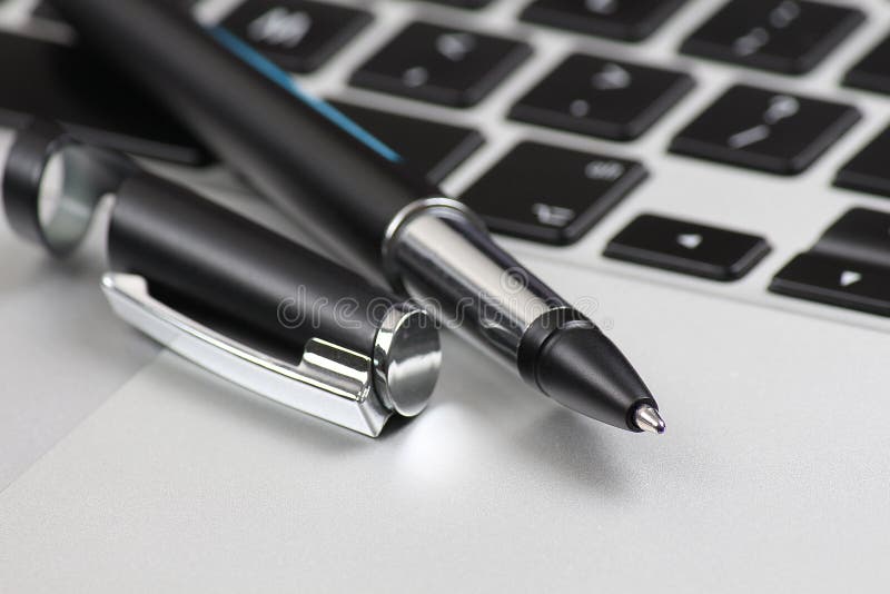 Ballpoint Pen on Computer Keyboard Stock Photo - Image of laptop ...