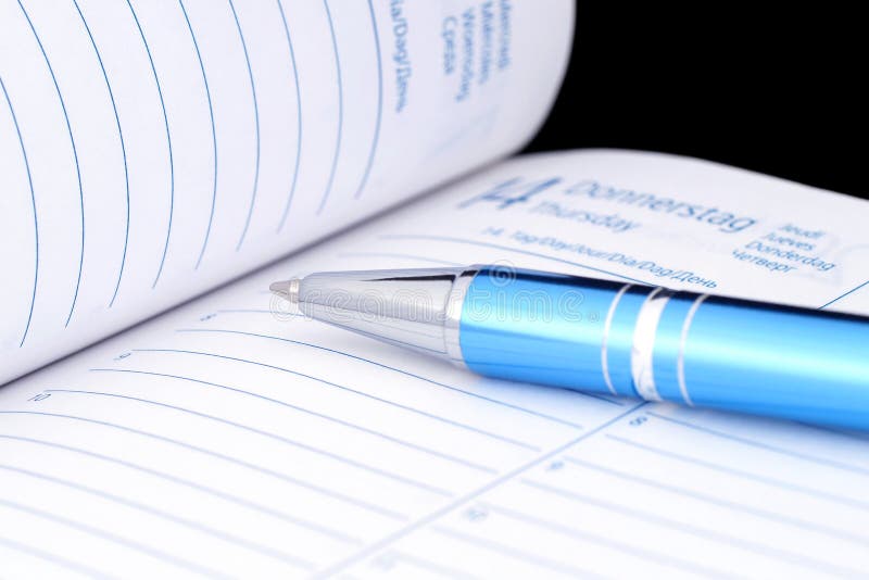 Ballpoint pen on notebook. stock photo. Image of calendar - 65840812
